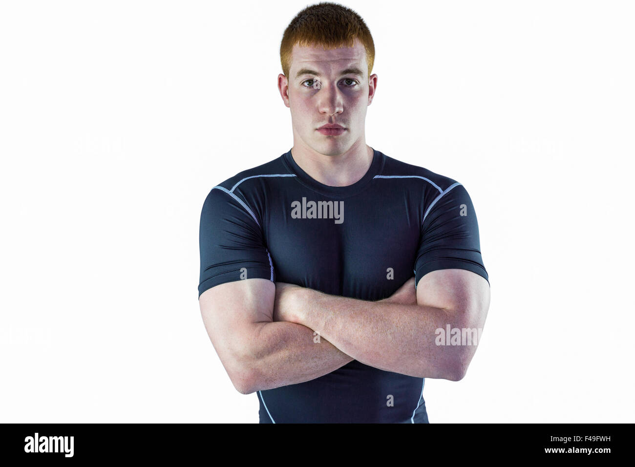 Muscular rugby player with arms crossed Stock Photo - Alamy