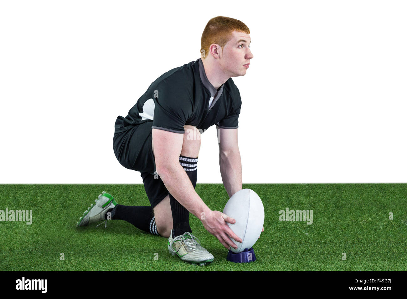 Rugby player ready to make a drop kick Stock Photo - Alamy