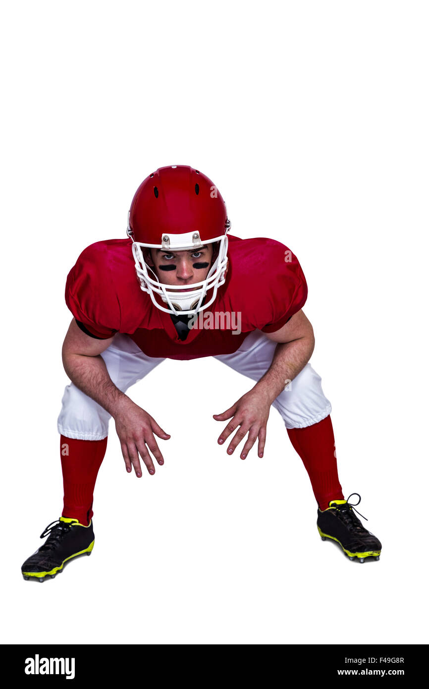 American football player in attack stance Stock Photo - Alamy