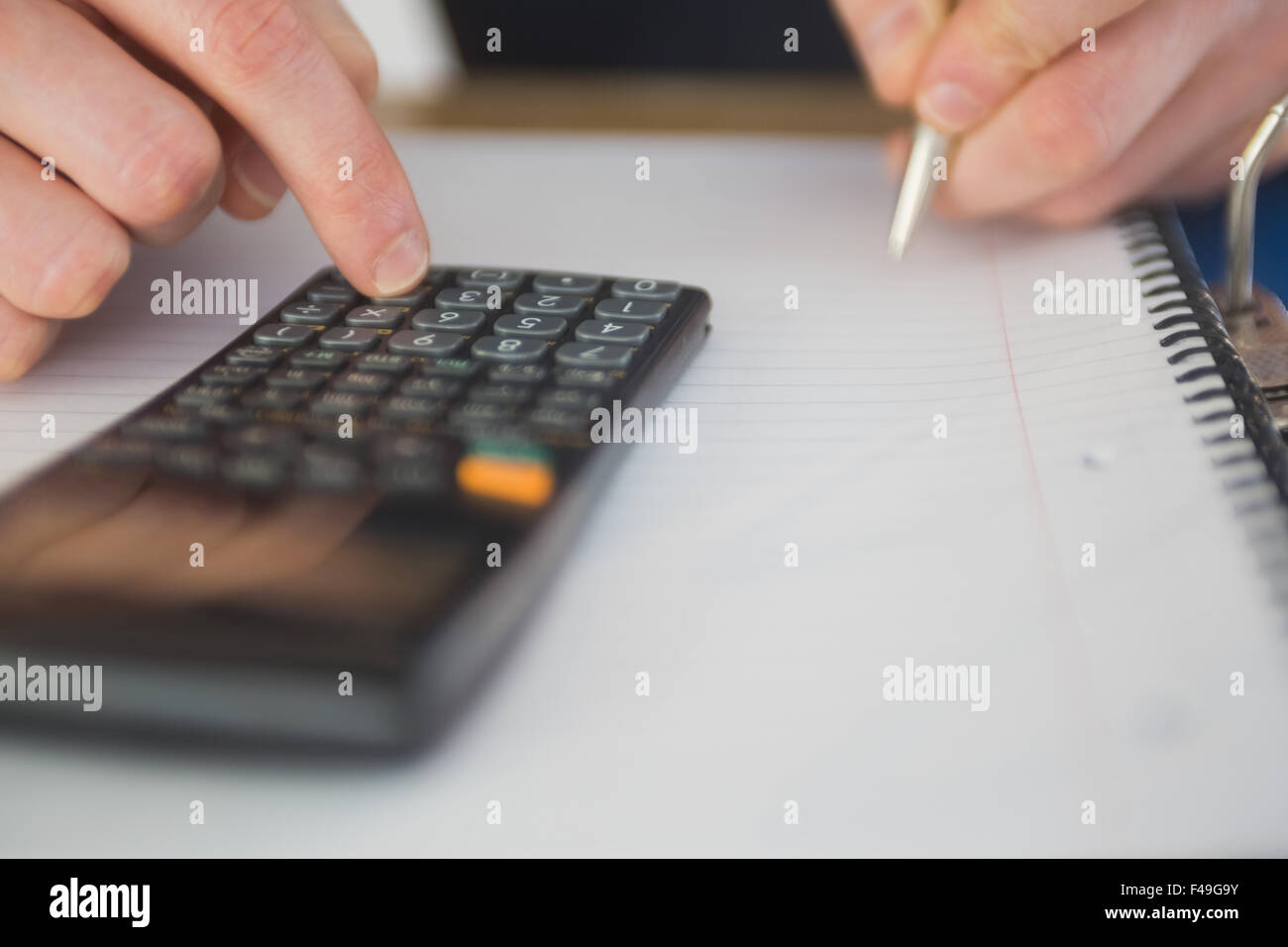 Elegant young businessman calculator hi-res stock photography and ...