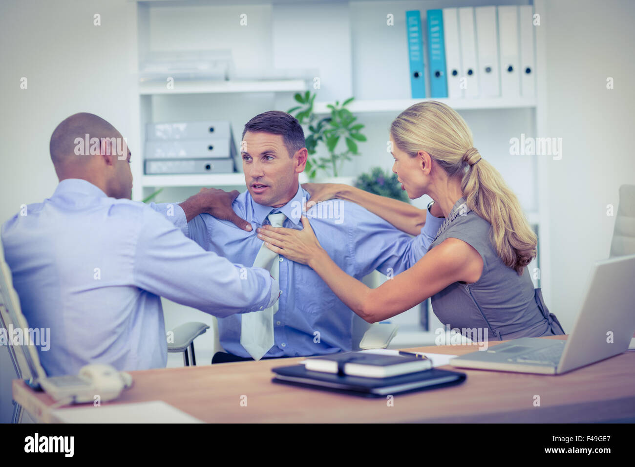 Business partners fighting together Stock Photo - Alamy