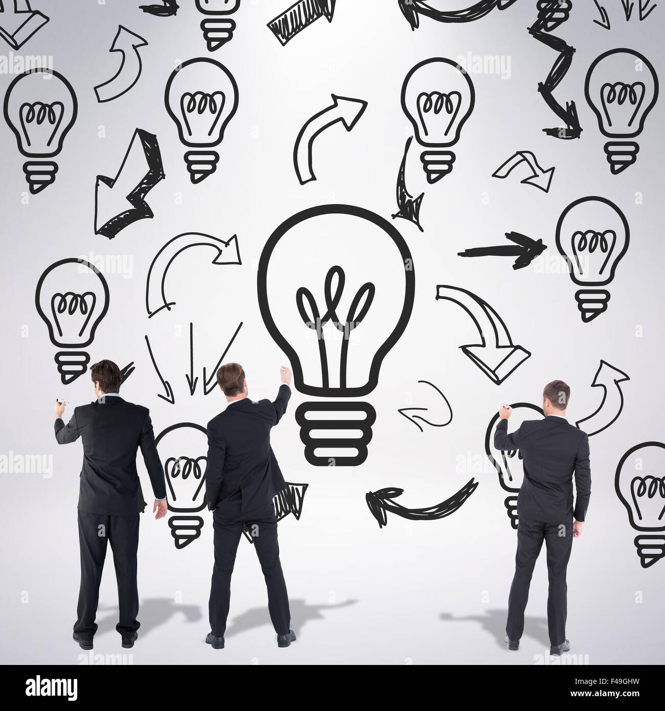 Composite image of business team writing Stock Photo - Alamy