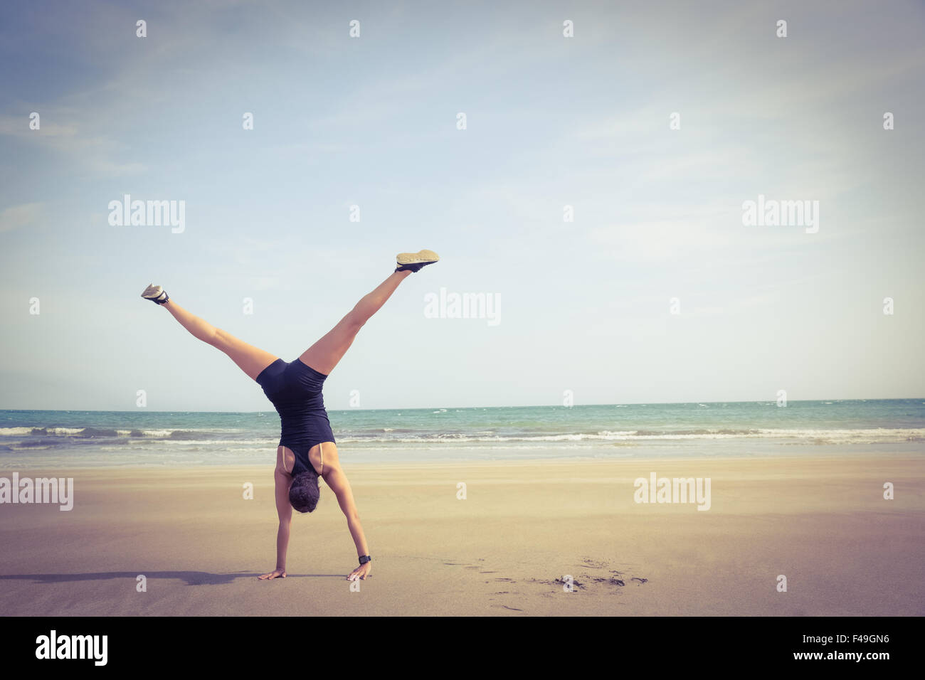 Woman cartwheel hi-res stock photography and images - Alamy