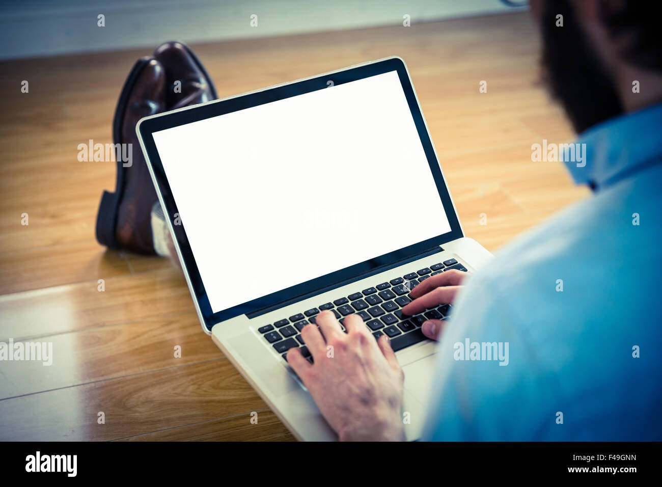 Handsome hipster using his laptop Stock Photo - Alamy