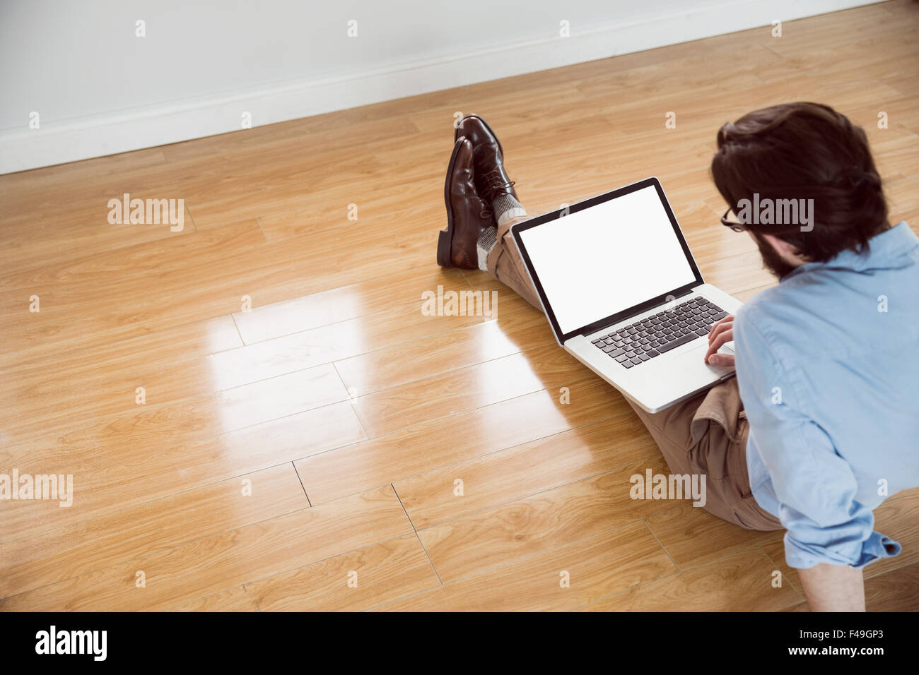 Handsome hipster using his laptop Stock Photo - Alamy