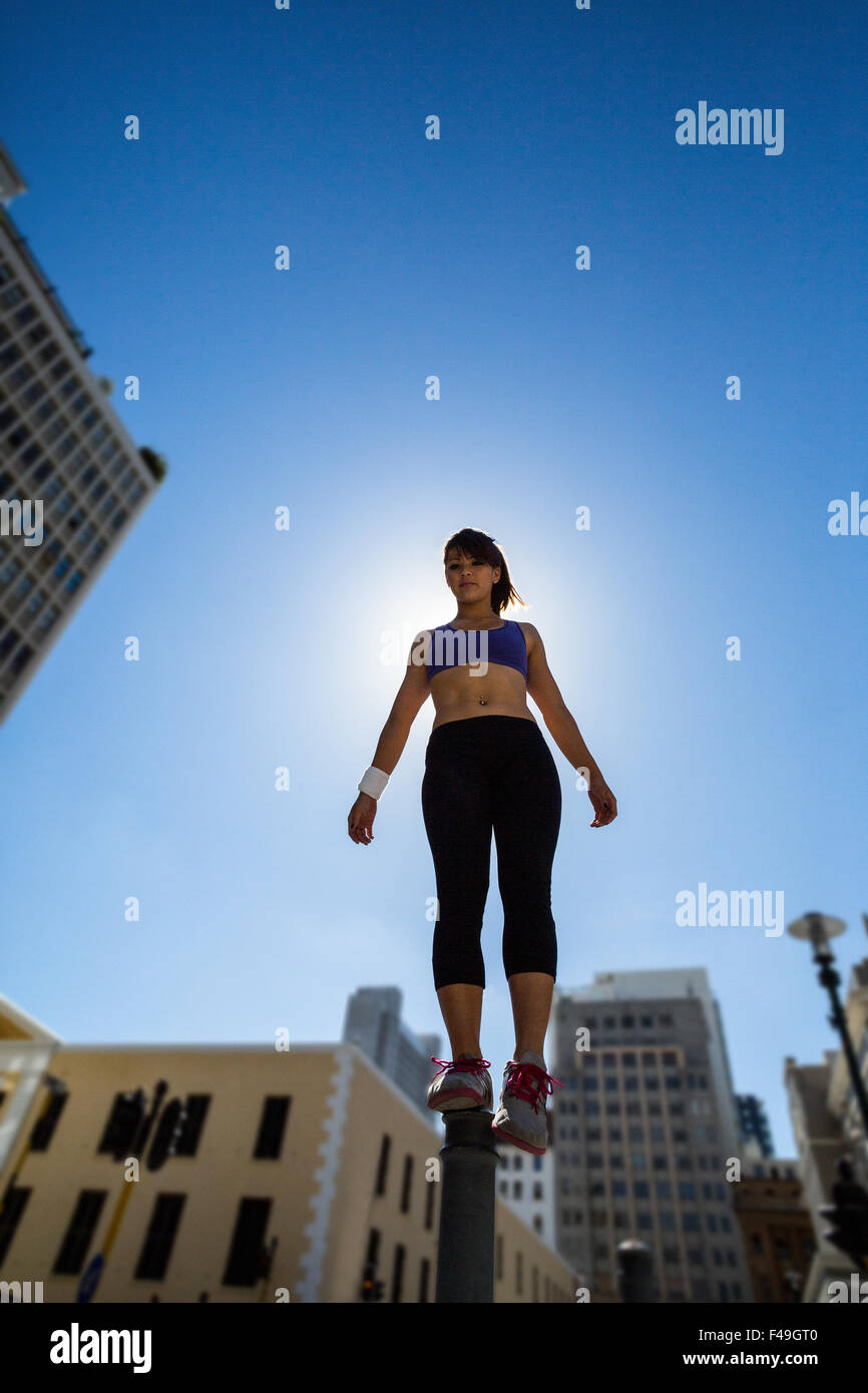 Female outdoors exercising balancing on hi-res stock photography and ...