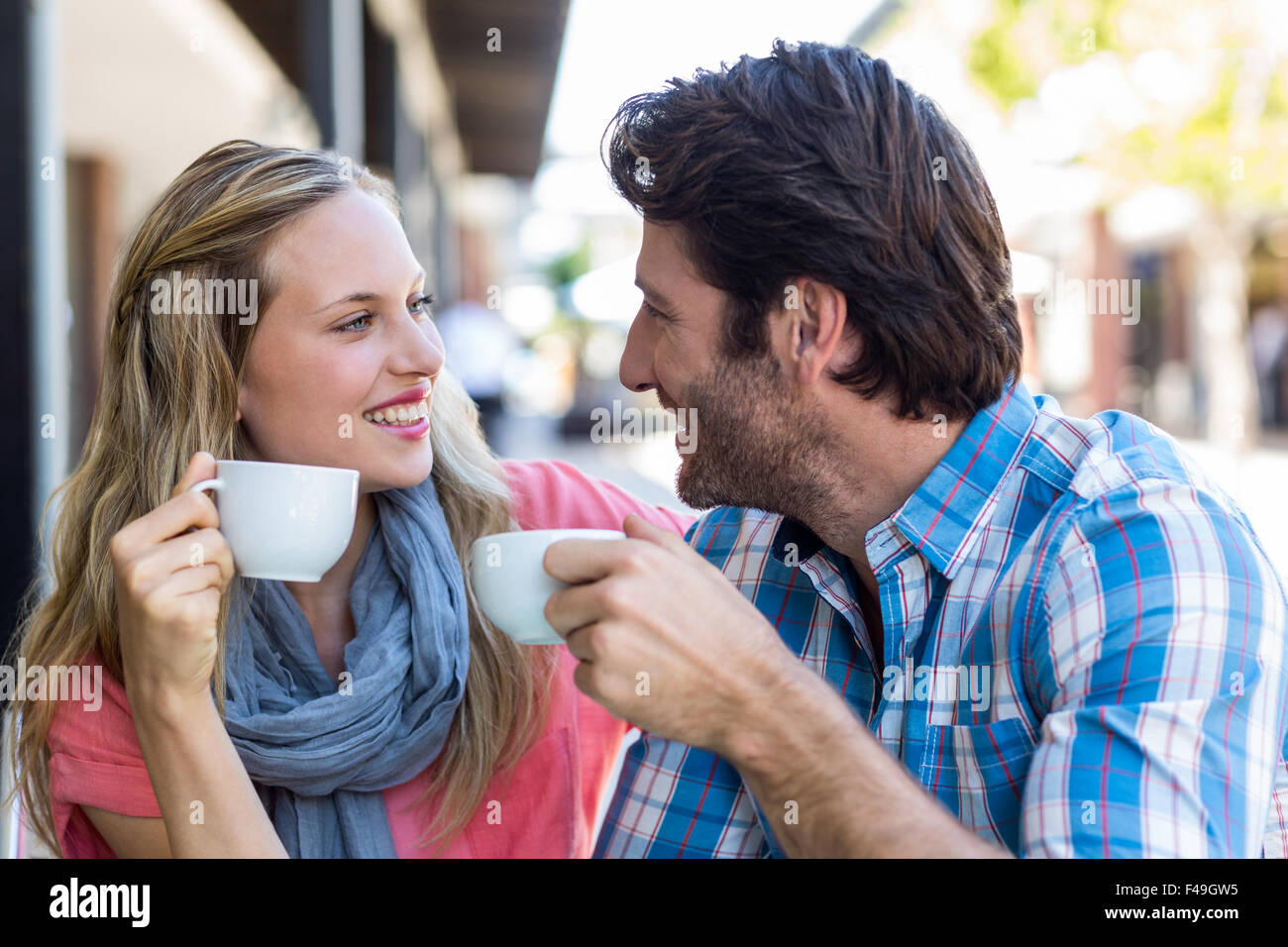 Cute couple having coffee together Stock Photo - Alamy