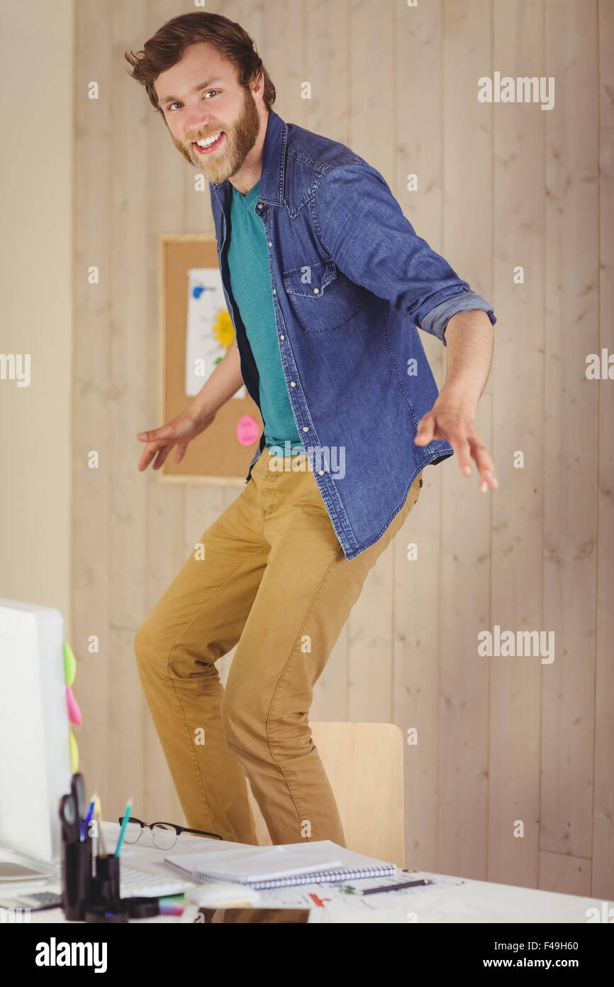 Stylish young man standing chair hi-res stock photography and images ...
