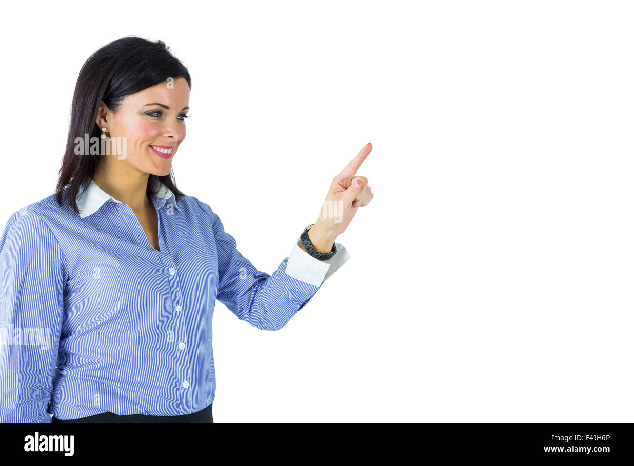Businesswoman standing and pointing Stock Photo - Alamy