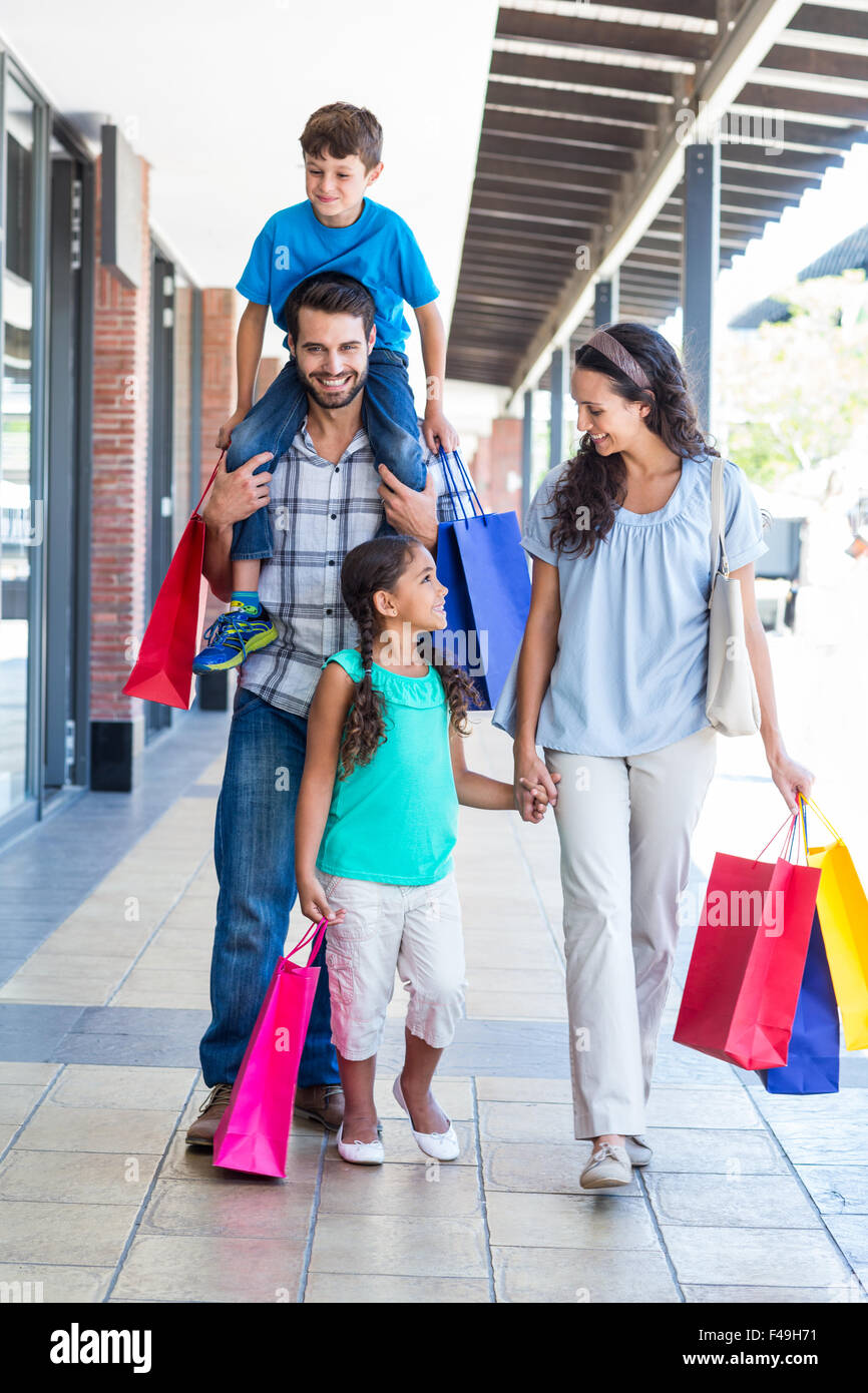 Happy family having fun in the mall Stock Photo - Alamy