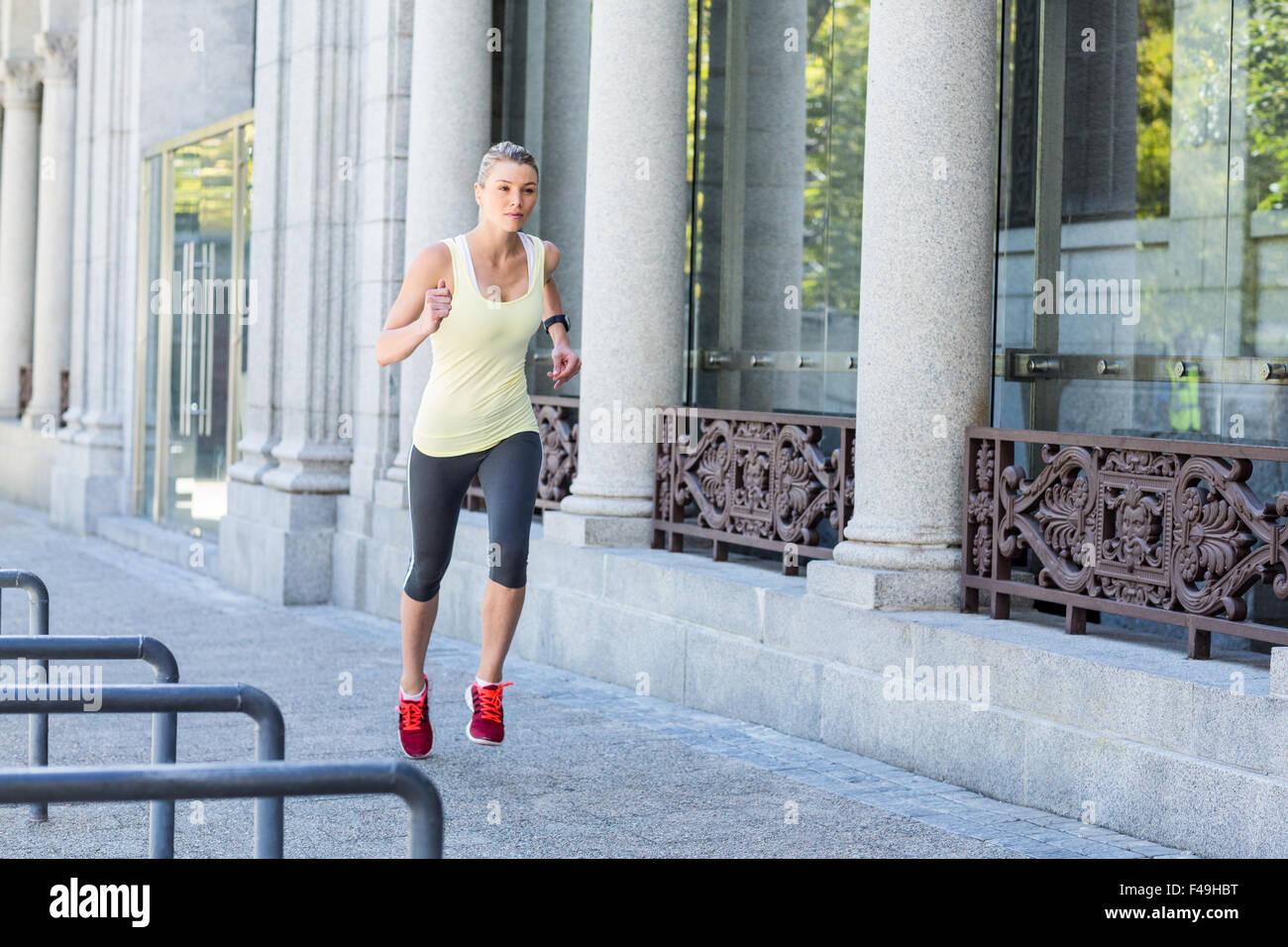 A beautiful woman running in the street Stock Photo - Alamy