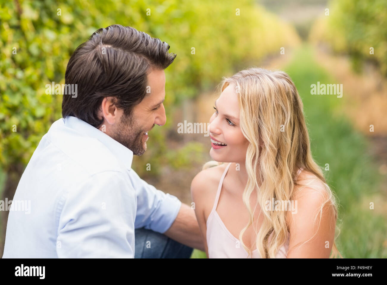Young happy couple smiling at each other Stock Photo - Alamy