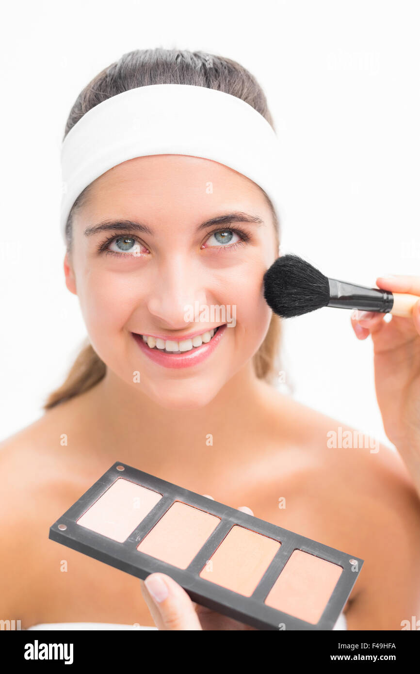 Hand applying blush to beautiful woman Stock Photo - Alamy