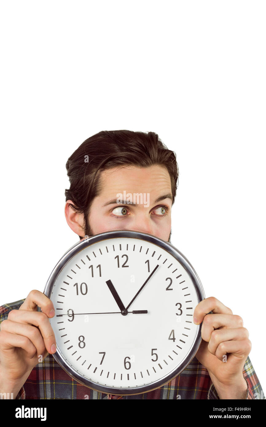 Handsome hipster showing a clock Stock Photo - Alamy