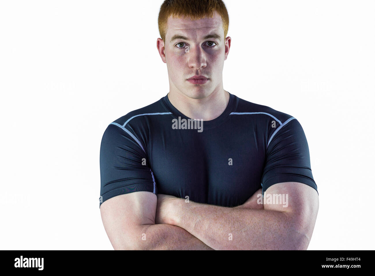 Muscular rugby player with arms crossed Stock Photo - Alamy