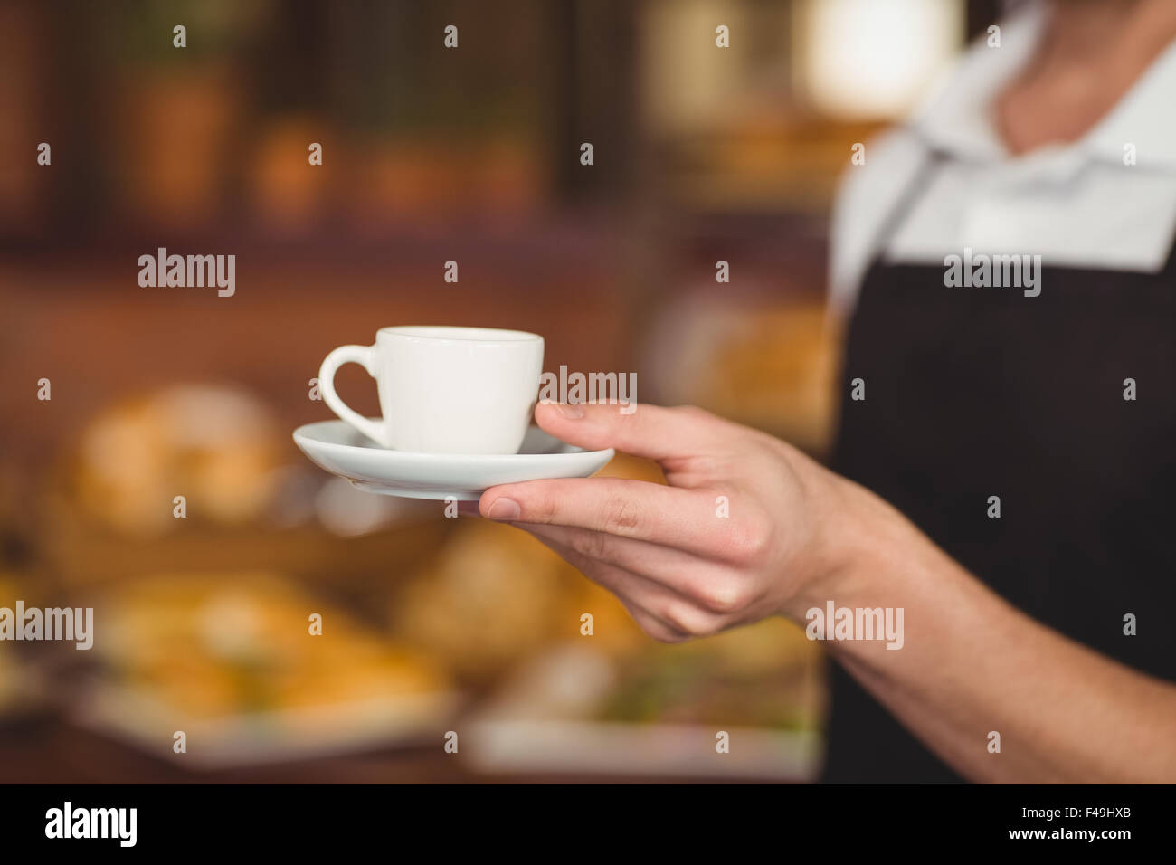 Man offering coffee cup hi-res stock photography and images - Alamy