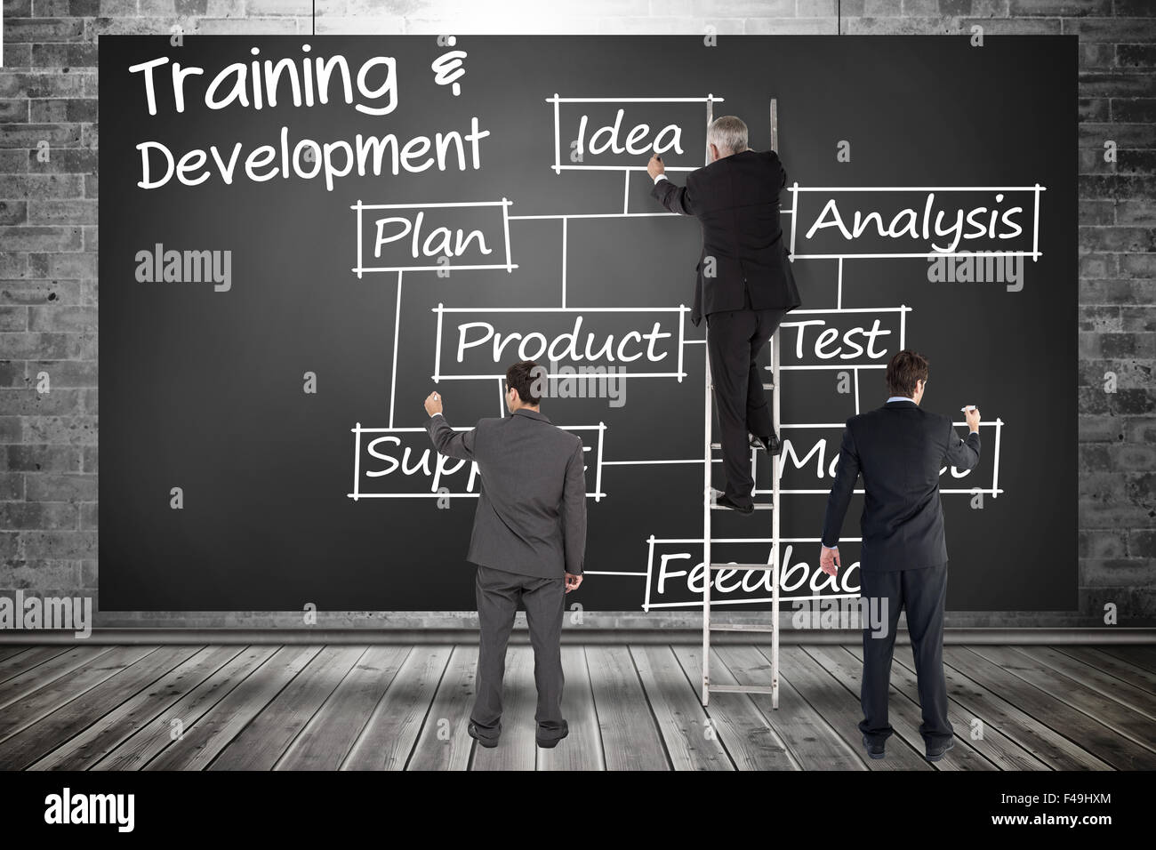 Composite image of business team writing Stock Photo - Alamy