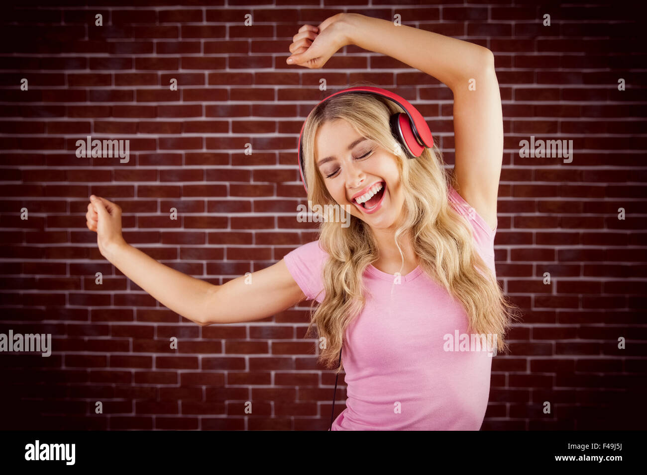 Beautiful woman dancing with headphones Stock Photo - Alamy