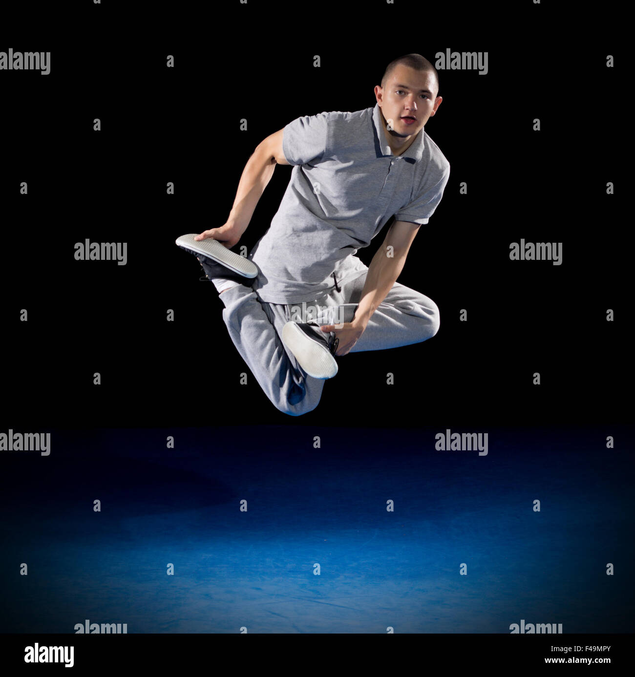Breakdancer training on dark background Stock Photo - Alamy