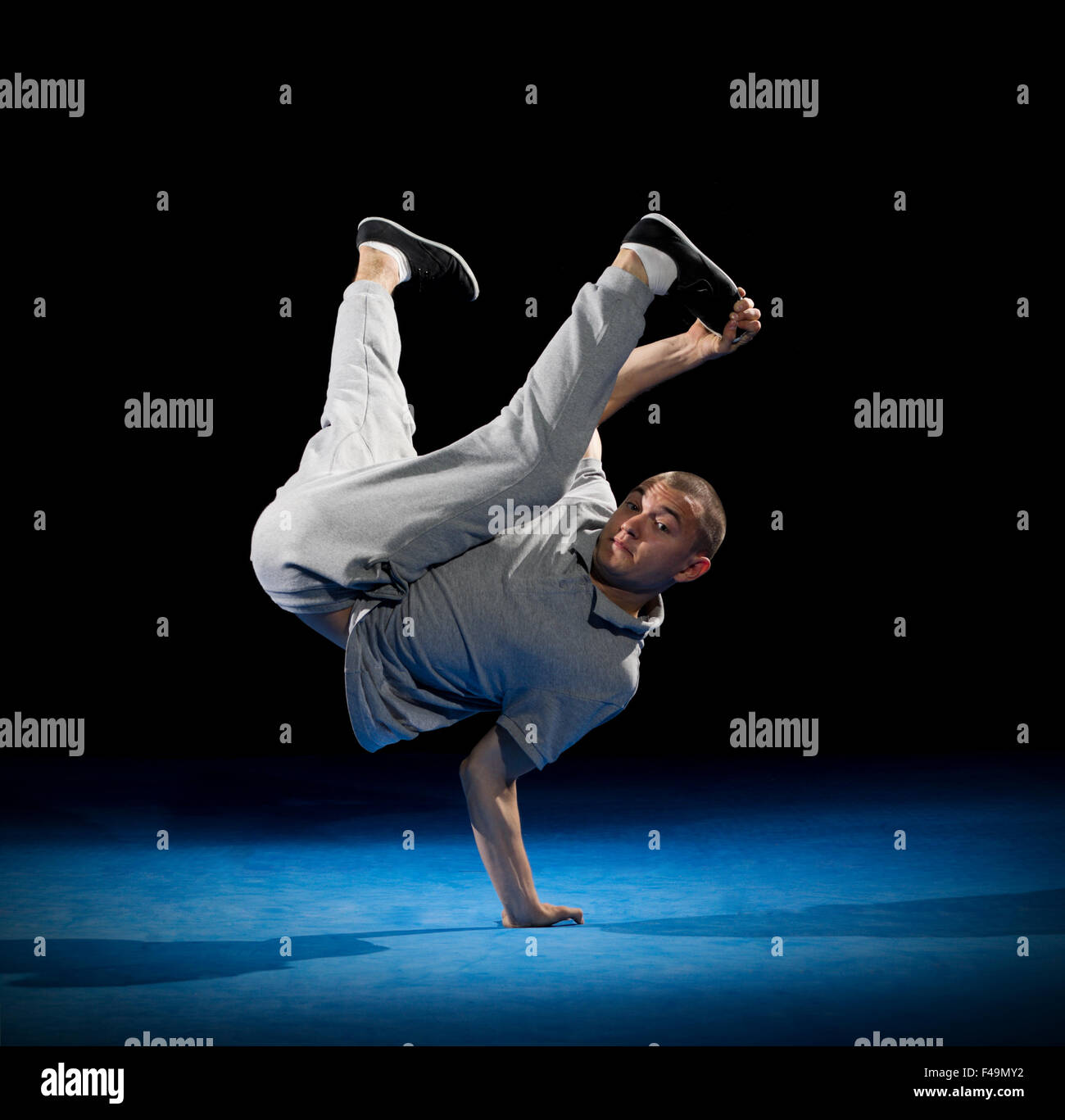 Breakdancer training on dark background Stock Photo - Alamy