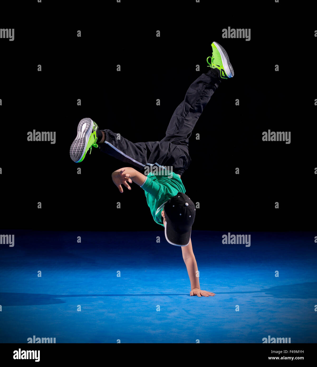 Little boy breakdancer on black Stock Photo - Alamy