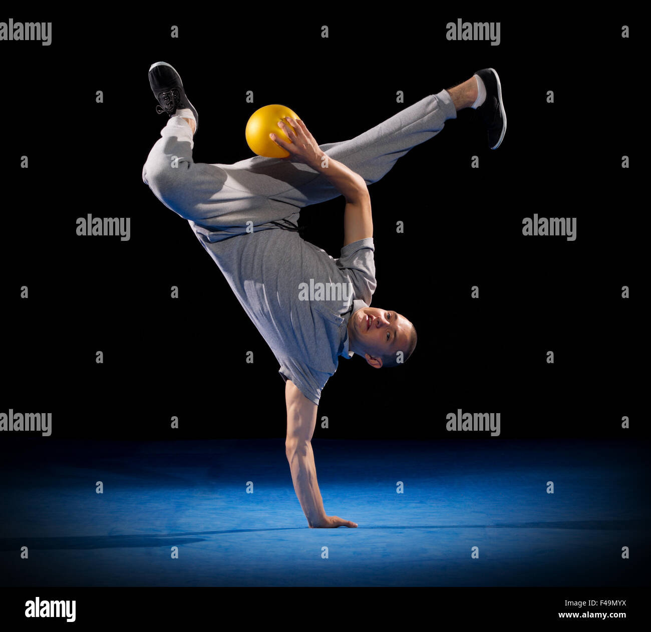 Breakdancer training on dark background Stock Photo - Alamy