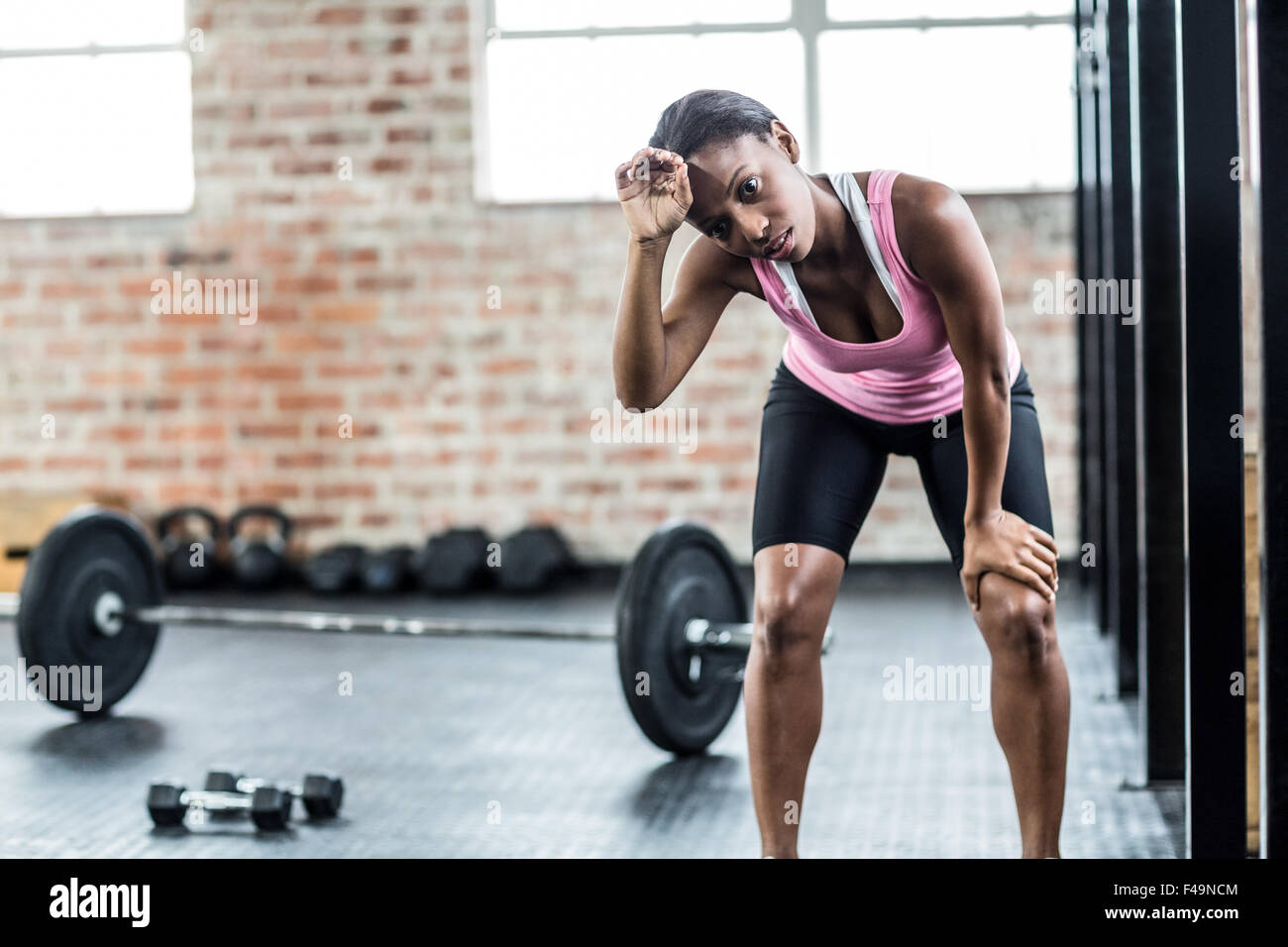 Fit tired woman face to the camera Stock Photo - Alamy
