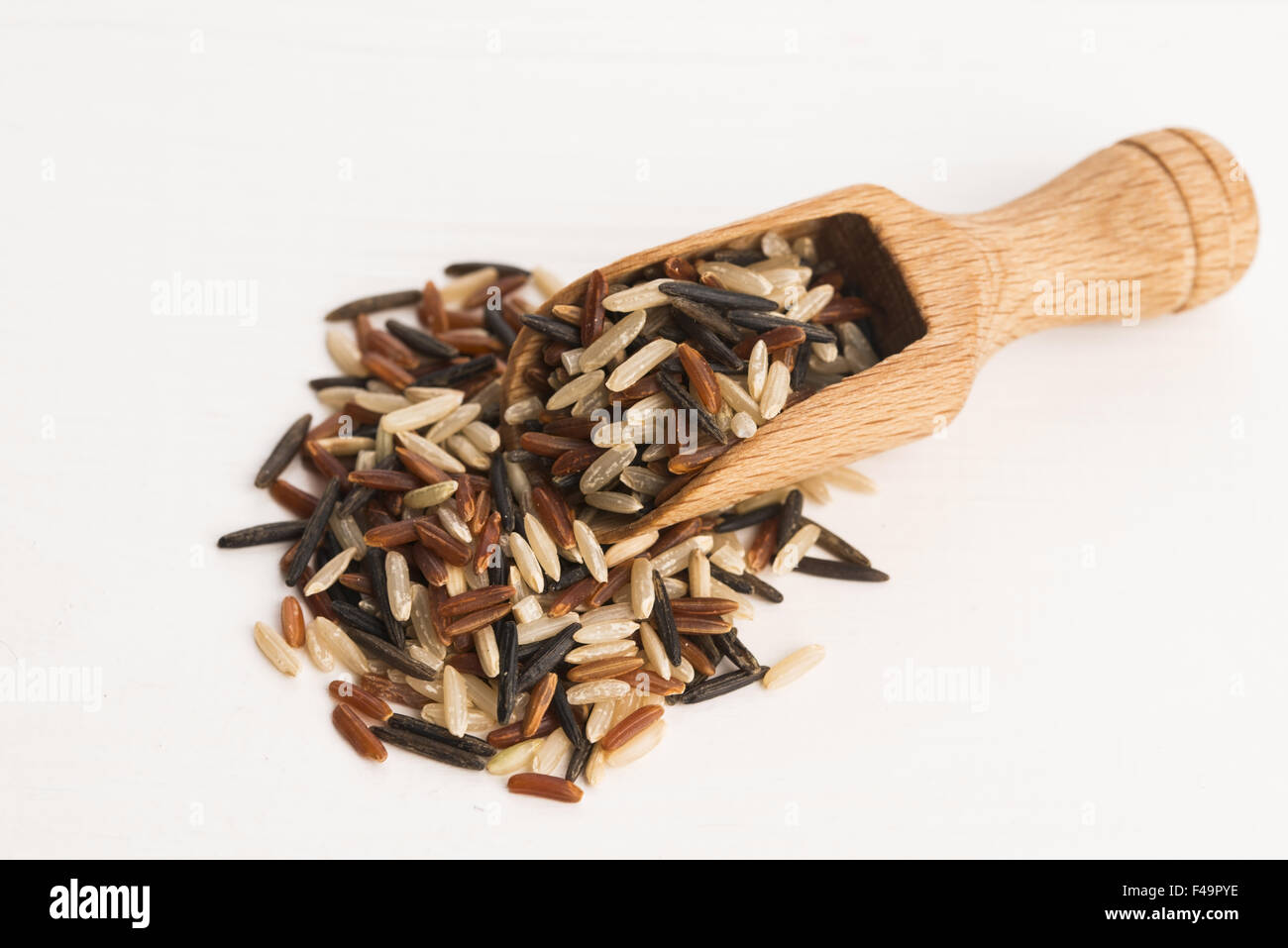 Wild rice grains wooden spoon hi-res stock photography and images - Alamy
