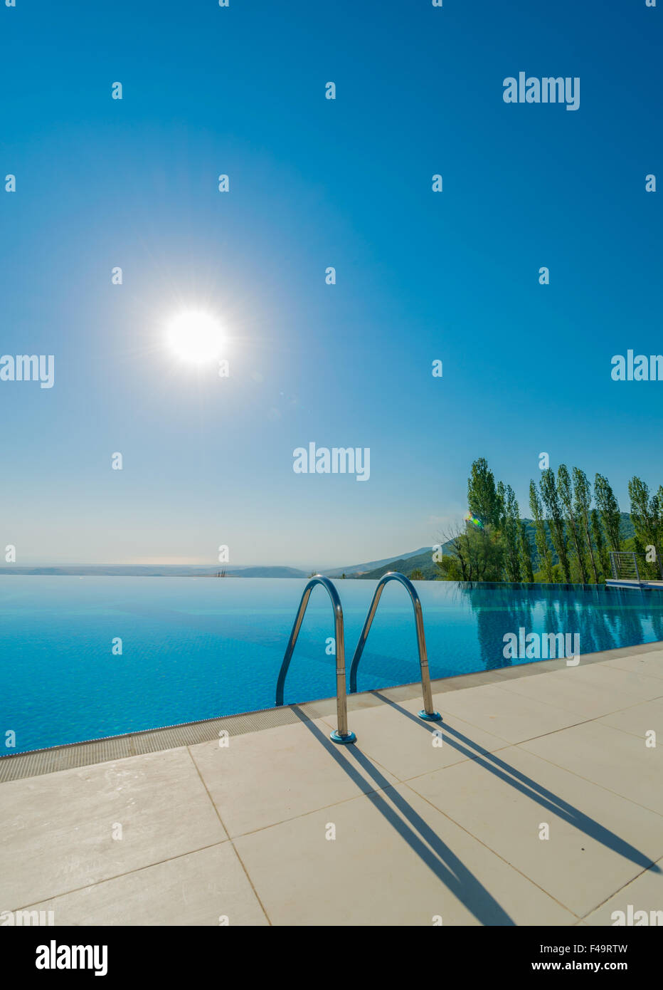 Infinity pool on the bright summer day Stock Photo - Alamy