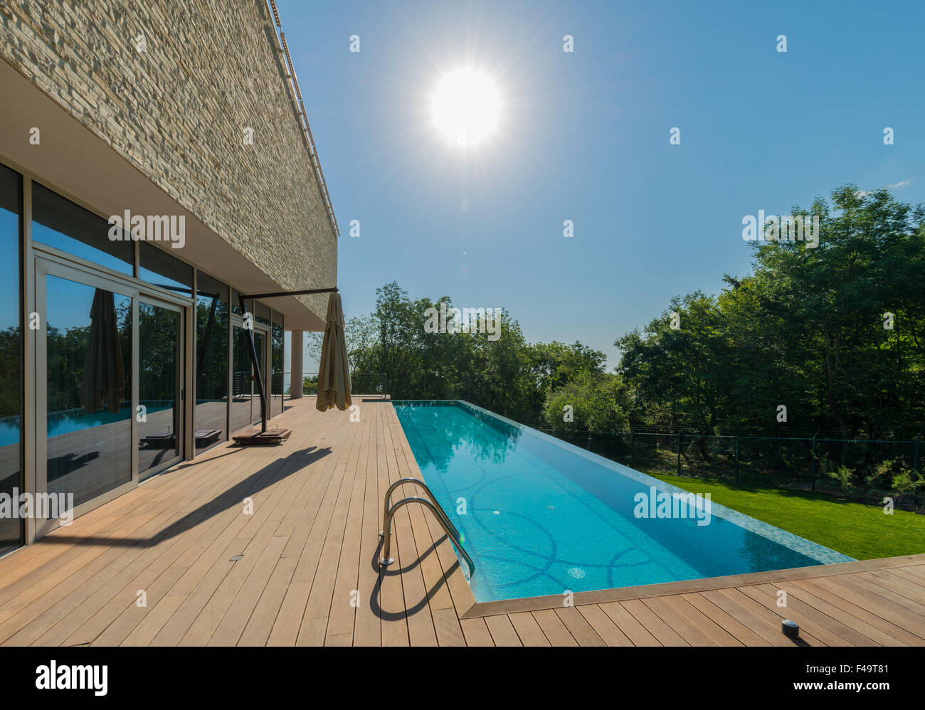 Infinity pool on the bright summer day Stock Photo - Alamy