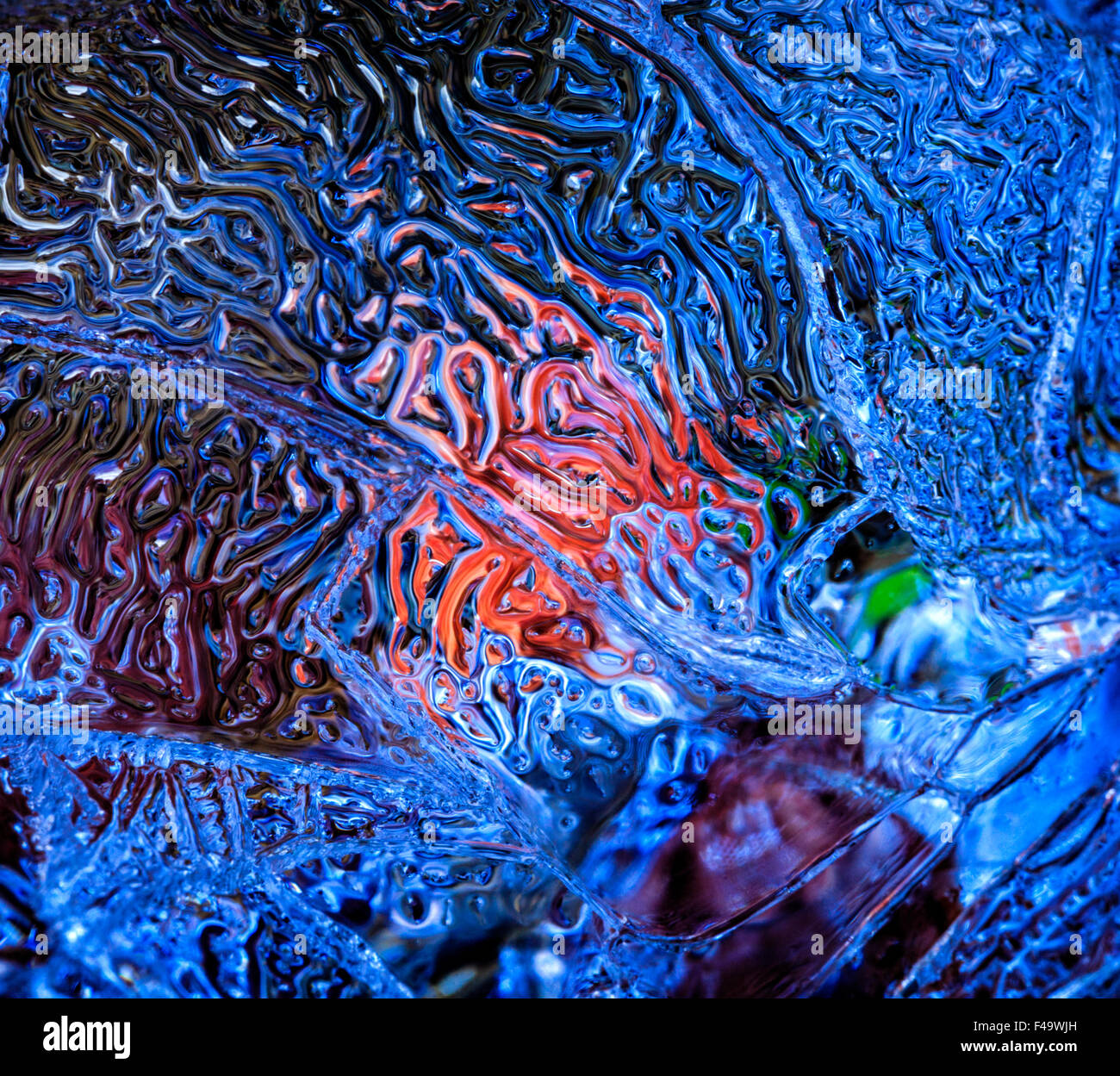 Extreme close-up image of beautiful ice formations in an outdoor water ...