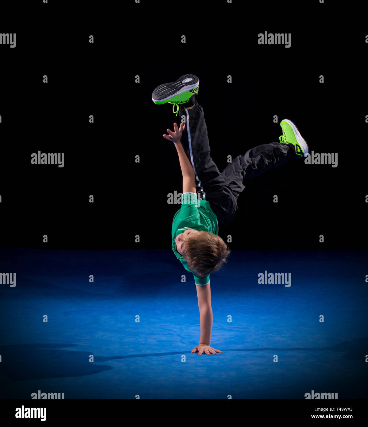 Little boy break dancer on black Stock Photo - Alamy