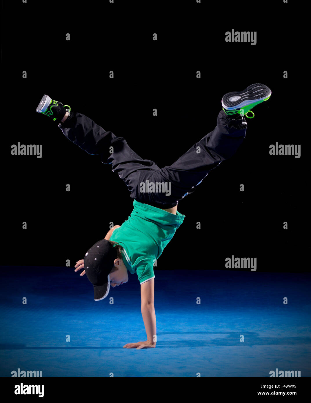 Little boy break dancer on black Stock Photo - Alamy