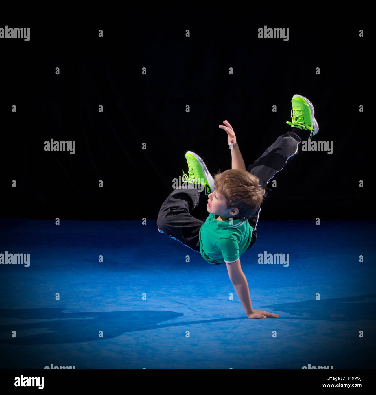 Little boy break dancer on black Stock Photo - Alamy