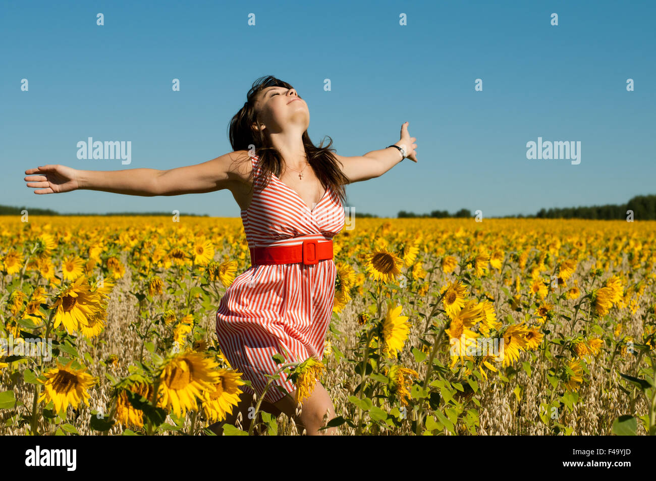 beautiful woman runs on a glade Stock Photo - Alamy