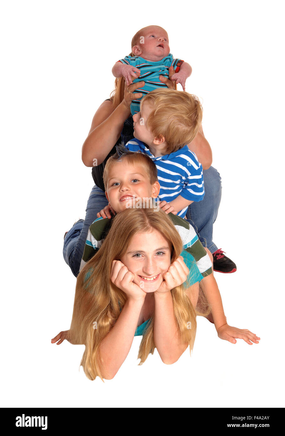 Pyramid of four kids on floor Stock Photo - Alamy