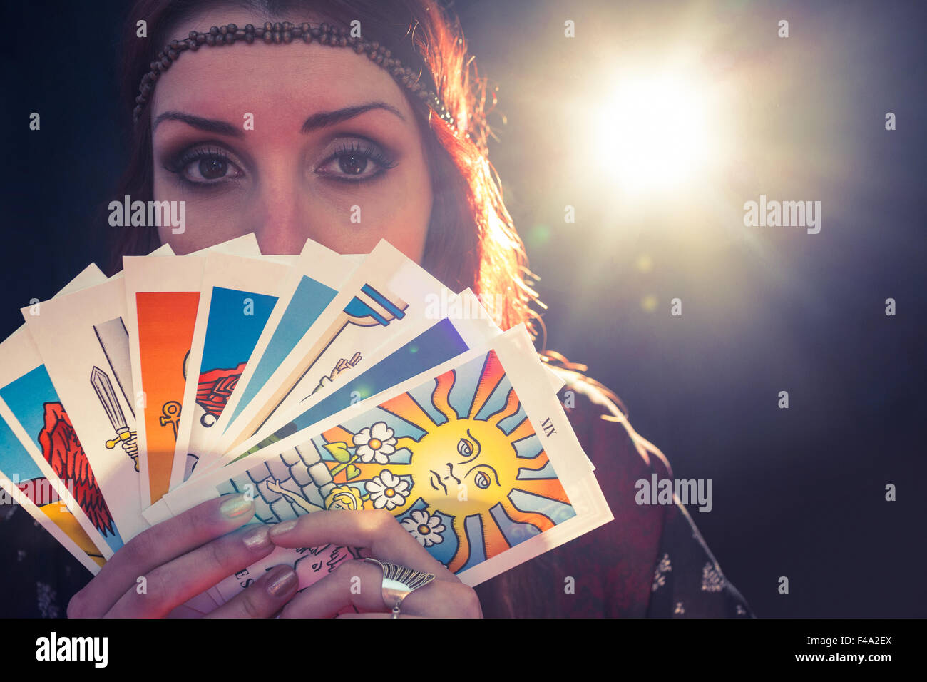 Fortune teller showing tarot cards bunch Stock Photo - Alamy