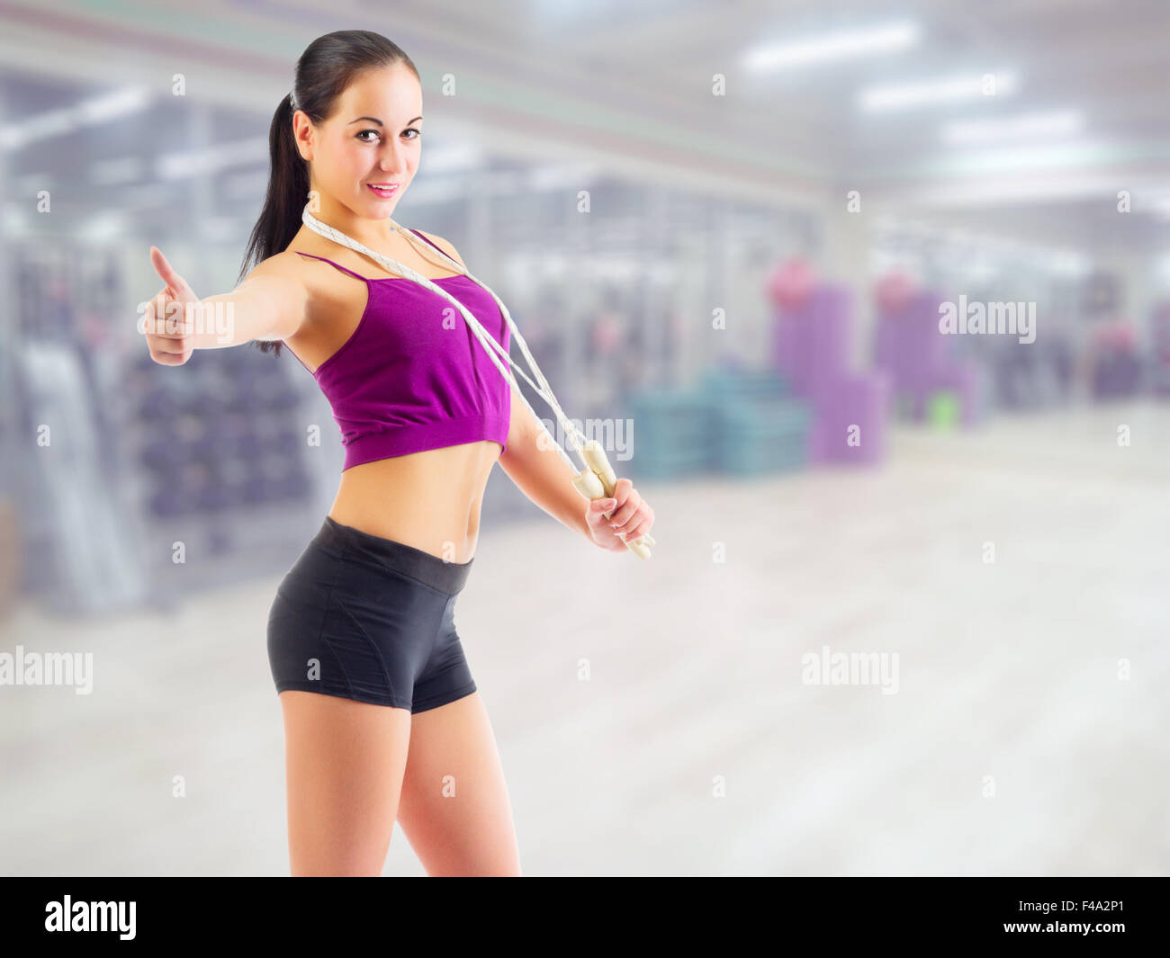 Sporty young girl at fitness club Stock Photo - Alamy