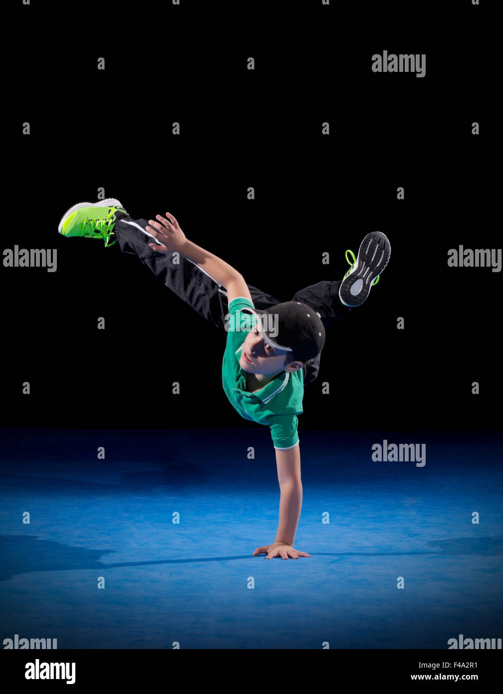Little boy breakdancer on black Stock Photo - Alamy