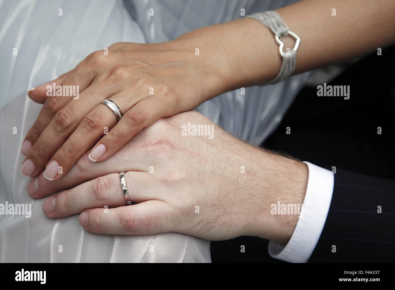 Husband wife putting wedding rings hi-res stock photography and images ...