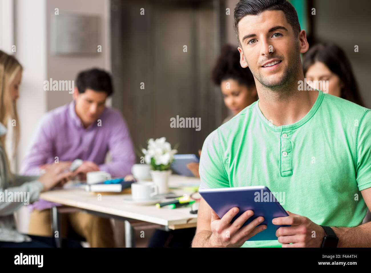 Student working on assignment with tablet Stock Photo - Alamy