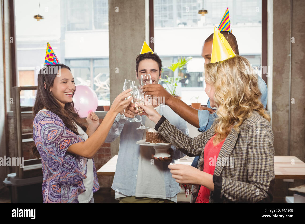 Happy colleagues enjoying at office Stock Photo - Alamy