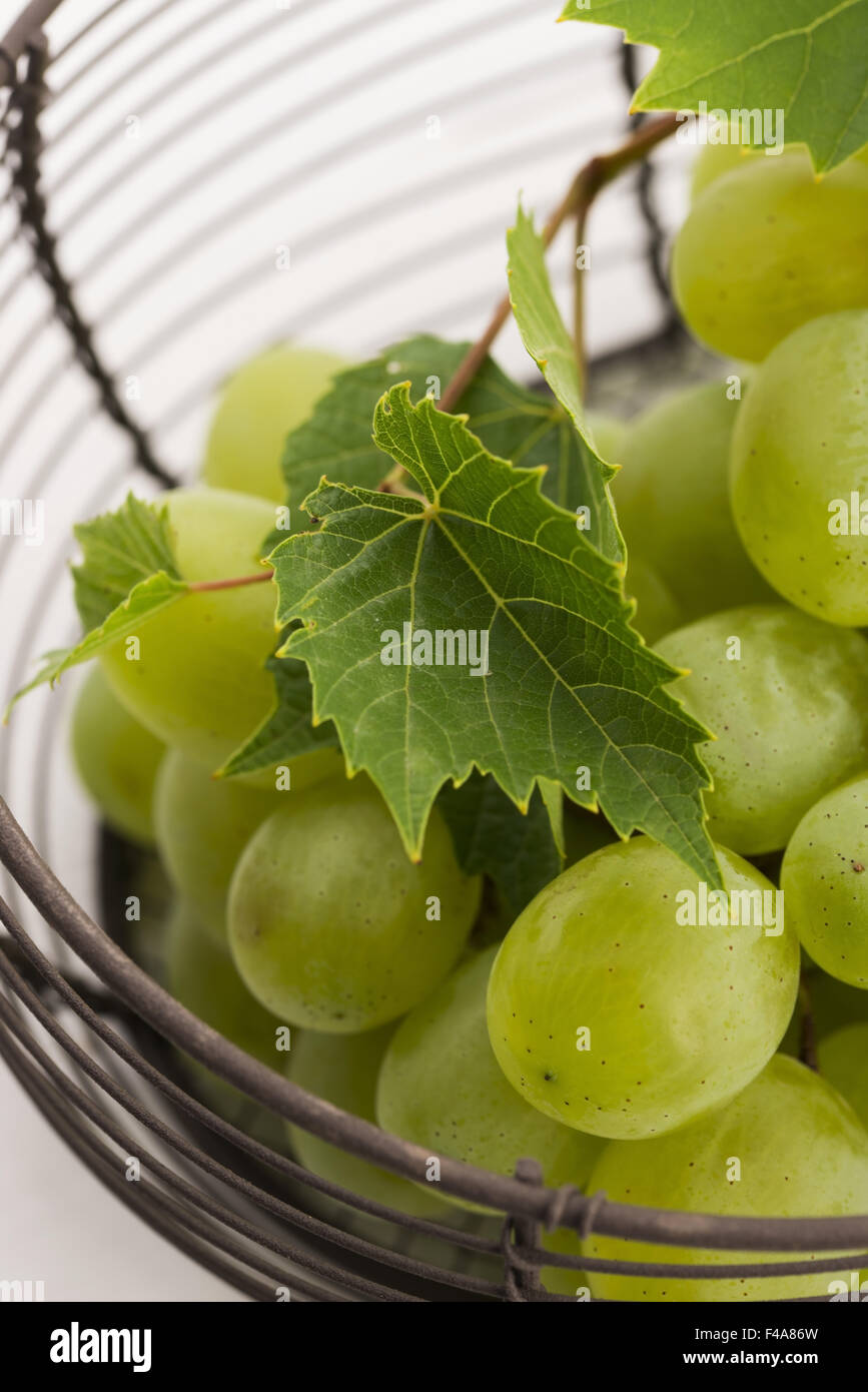 Bunch of white grapes in basket Stock Photo - Alamy