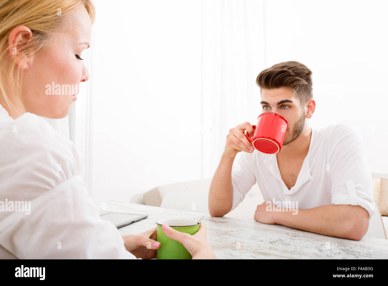 Young couple having a coffee break Stock Photo - Alamy