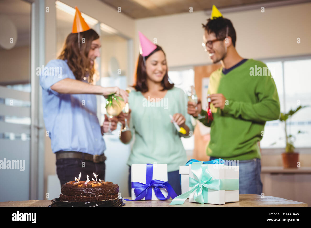 Business people having fun at birthday party Stock Photo - Alamy