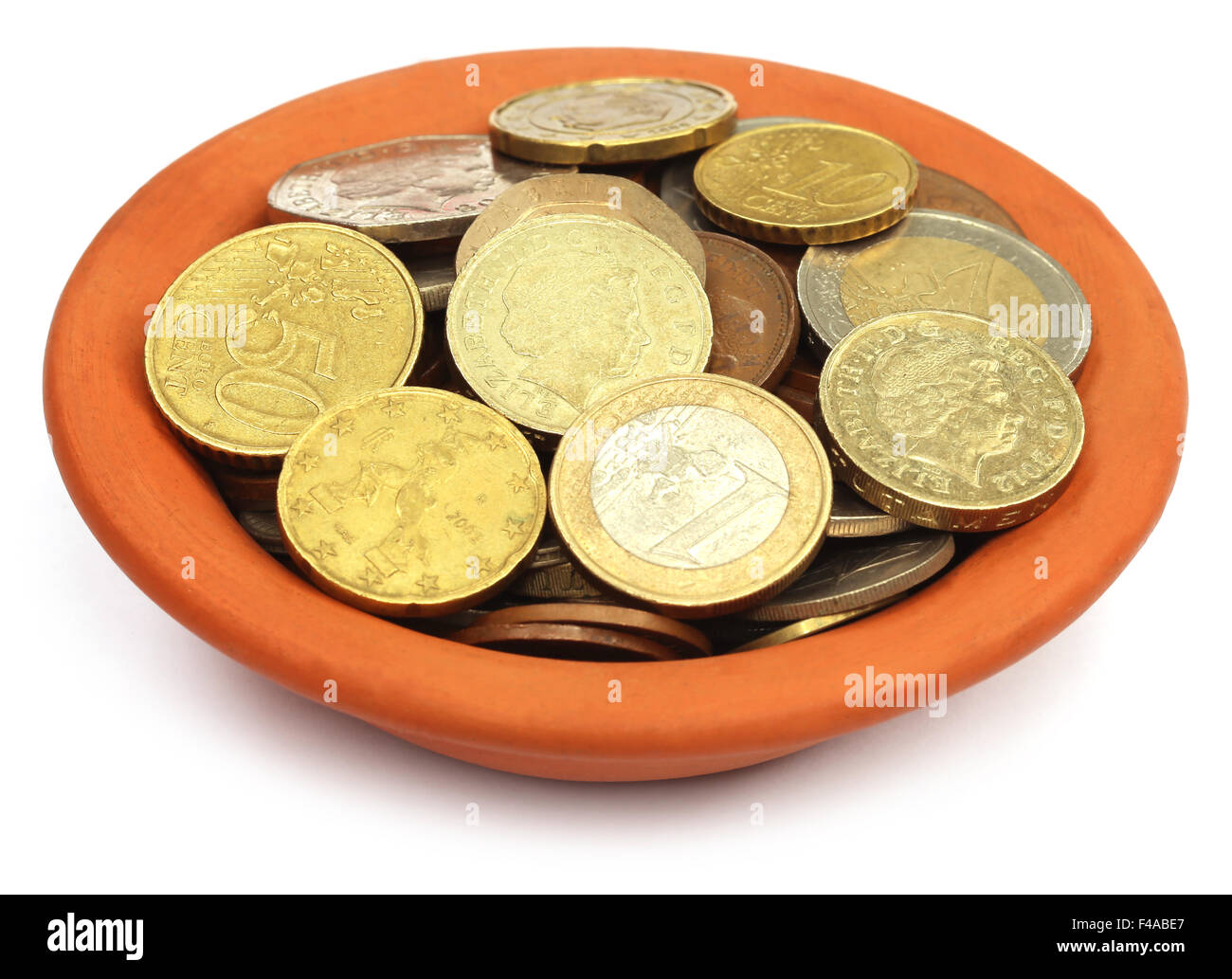 Coins in a bowl Stock Photo - Alamy