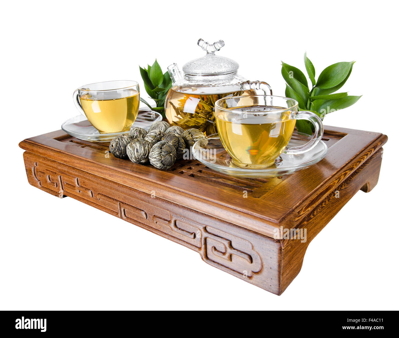 Teapot pouring out tea Cut Out Stock Images & Pictures - Alamy