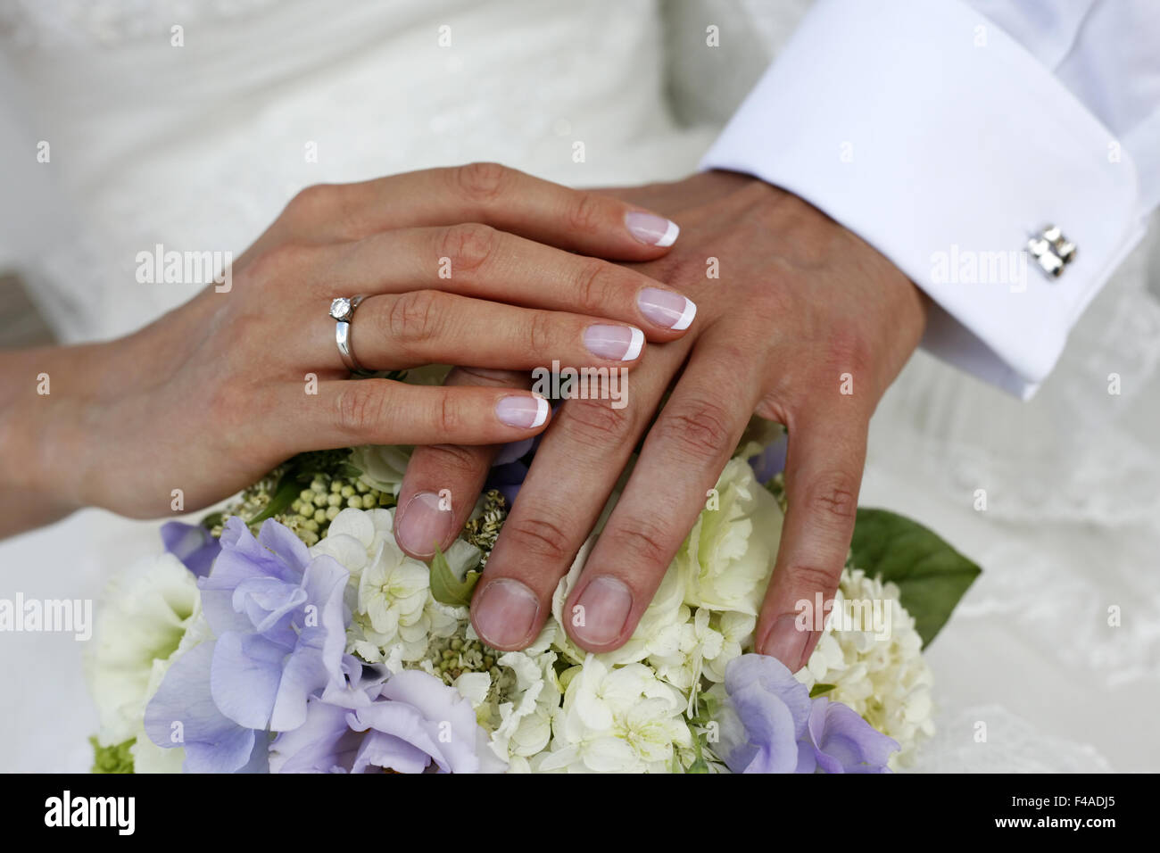Husband wife putting wedding rings hi-res stock photography and images ...