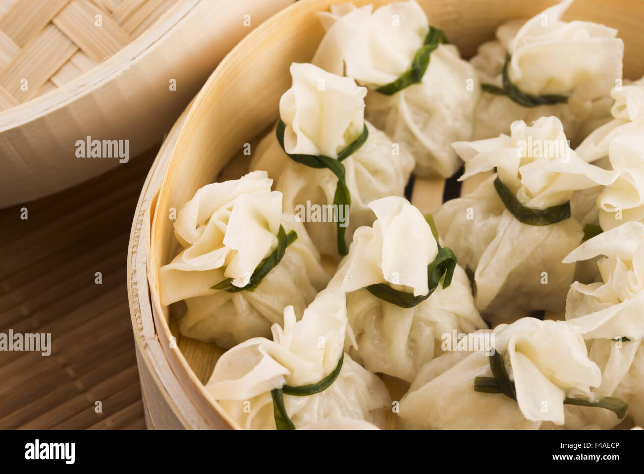 Chinese dumplings in bamboo steamers Stock Photo - Alamy