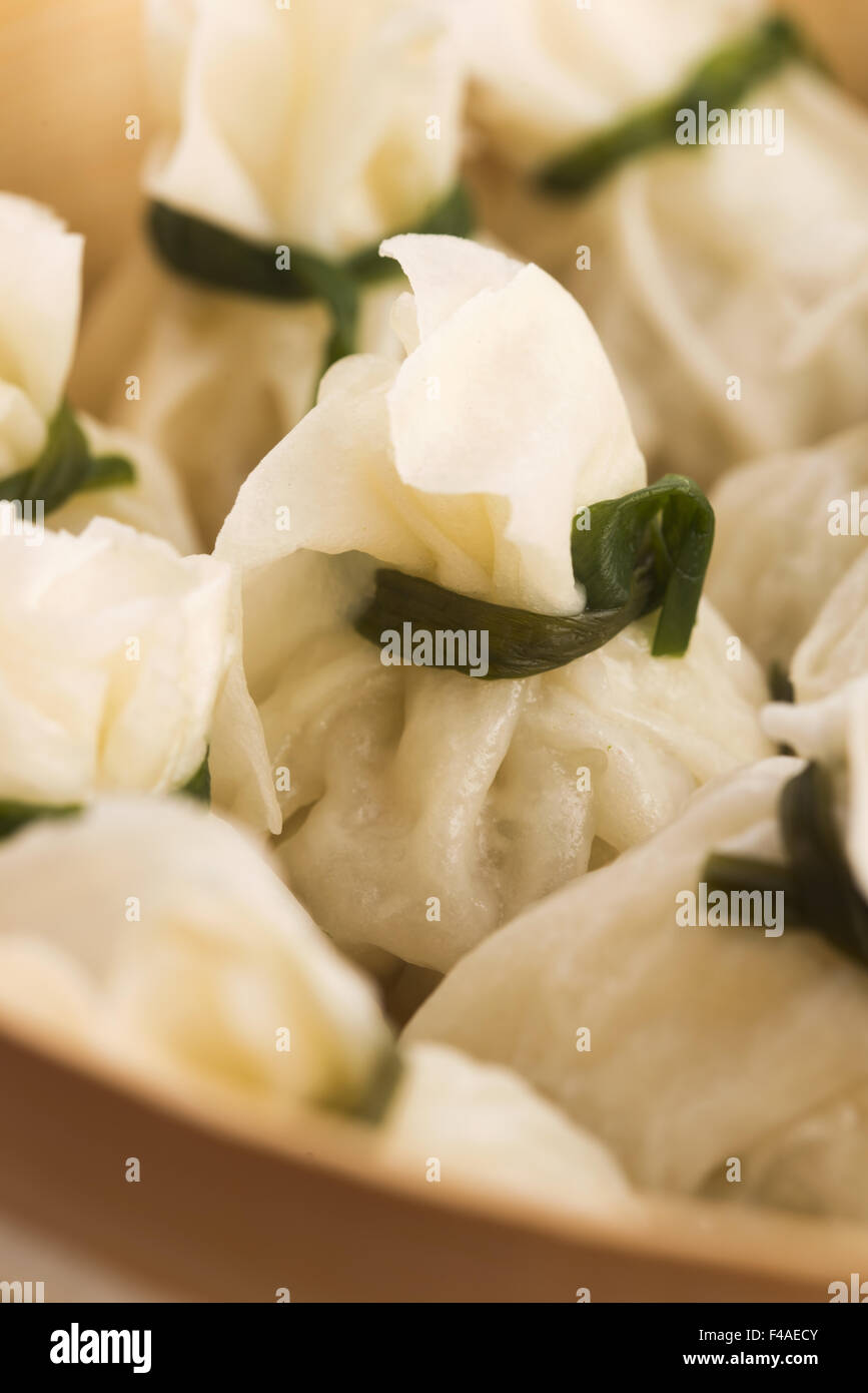 Chinese dumplings in bamboo steamers Stock Photo - Alamy